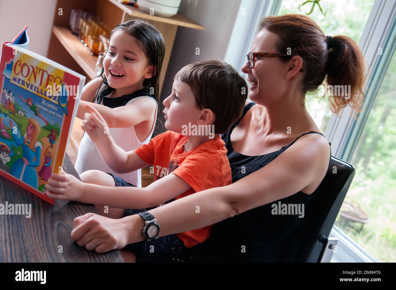 Mother reading book for children hi-res stock photography and images ...