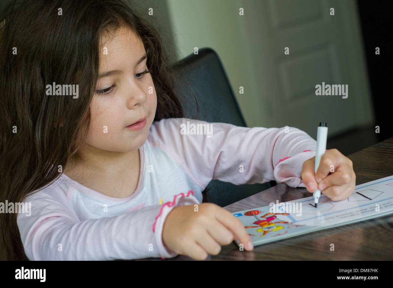Child doing math exercises Stock Photo - Alamy