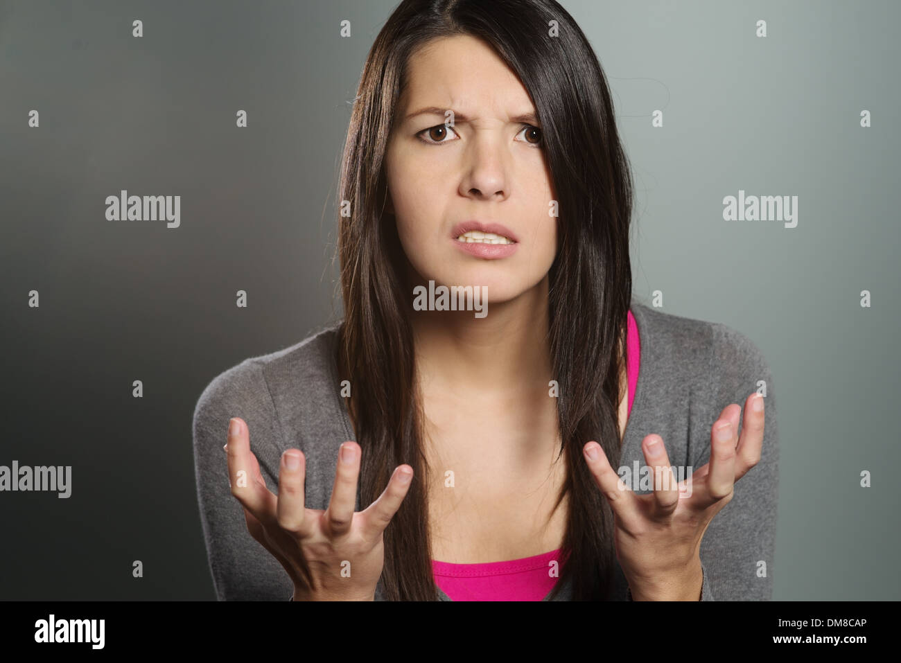 Young woman with a horrified expression Stock Photo - Alamy