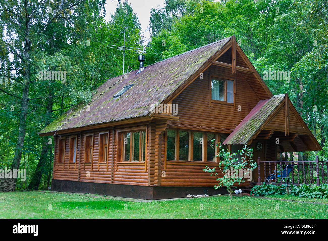 country wooden house in the forest Stock Photo - Alamy