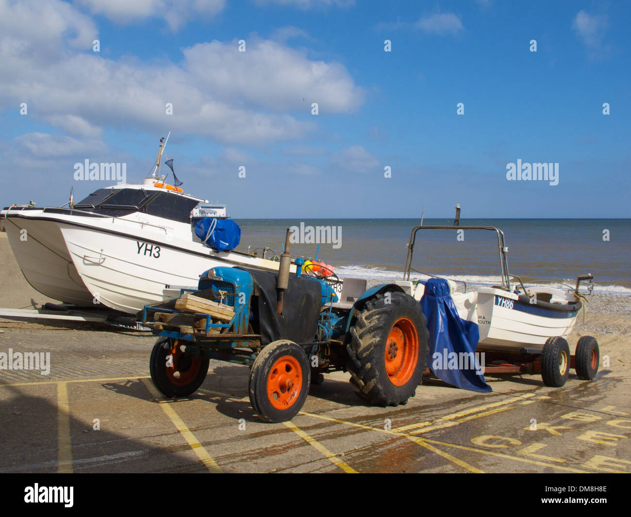 Tractors used on Cromer Beach, Norfolk, England, to move fishing boats ...