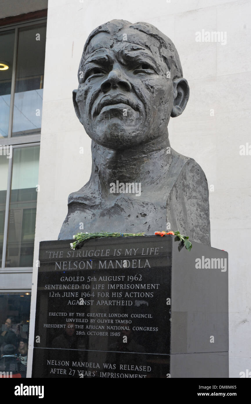 Tributes to Nelson Mandela at his statue Royal Festival Hall London ...