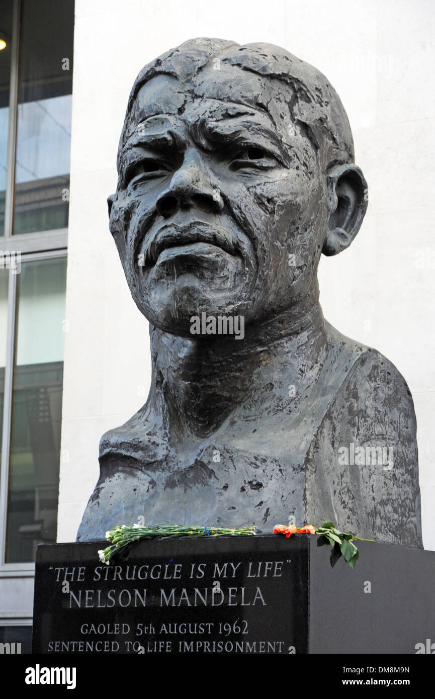Tributes to Nelson Mandela at his statue Royal Festival Hall London ...
