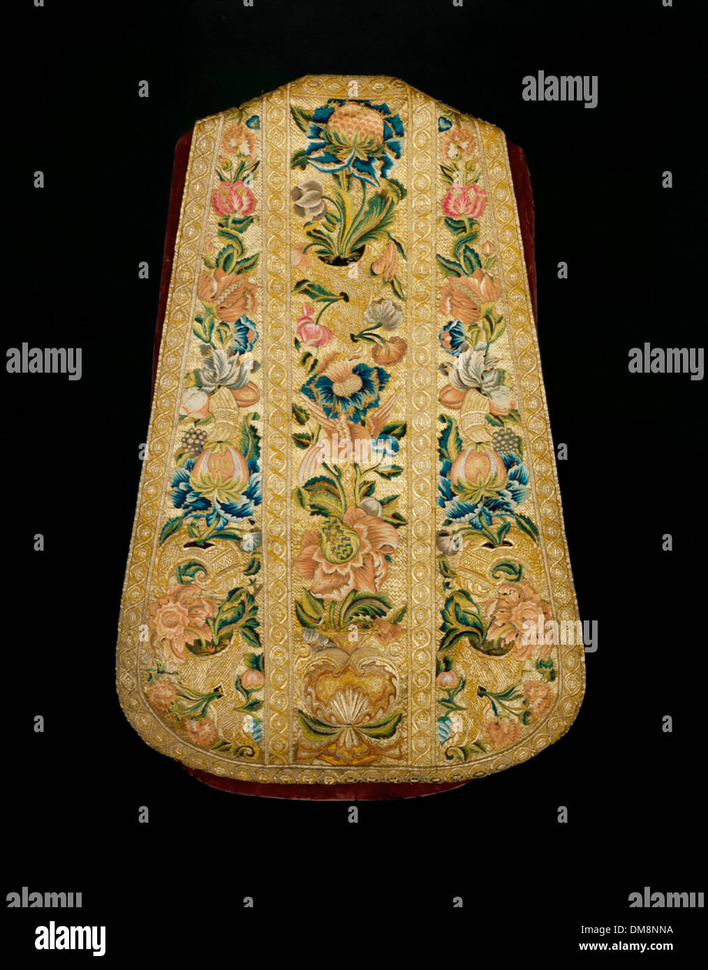 This set of ecclesiastical vestments, including chasubles, reflects the ...