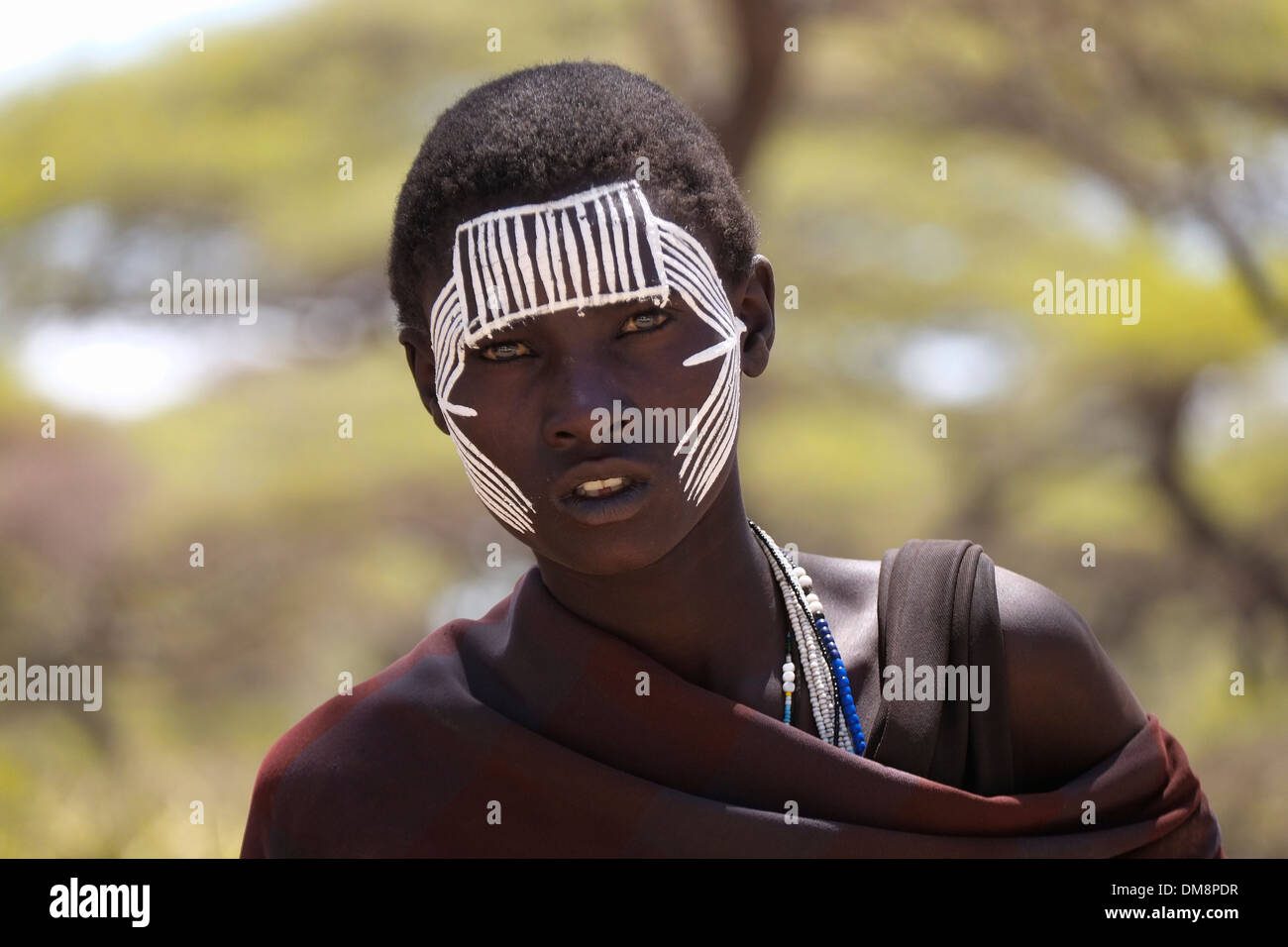 A teenage Maasai with painted face after the 'emorata' ceremony, which ...