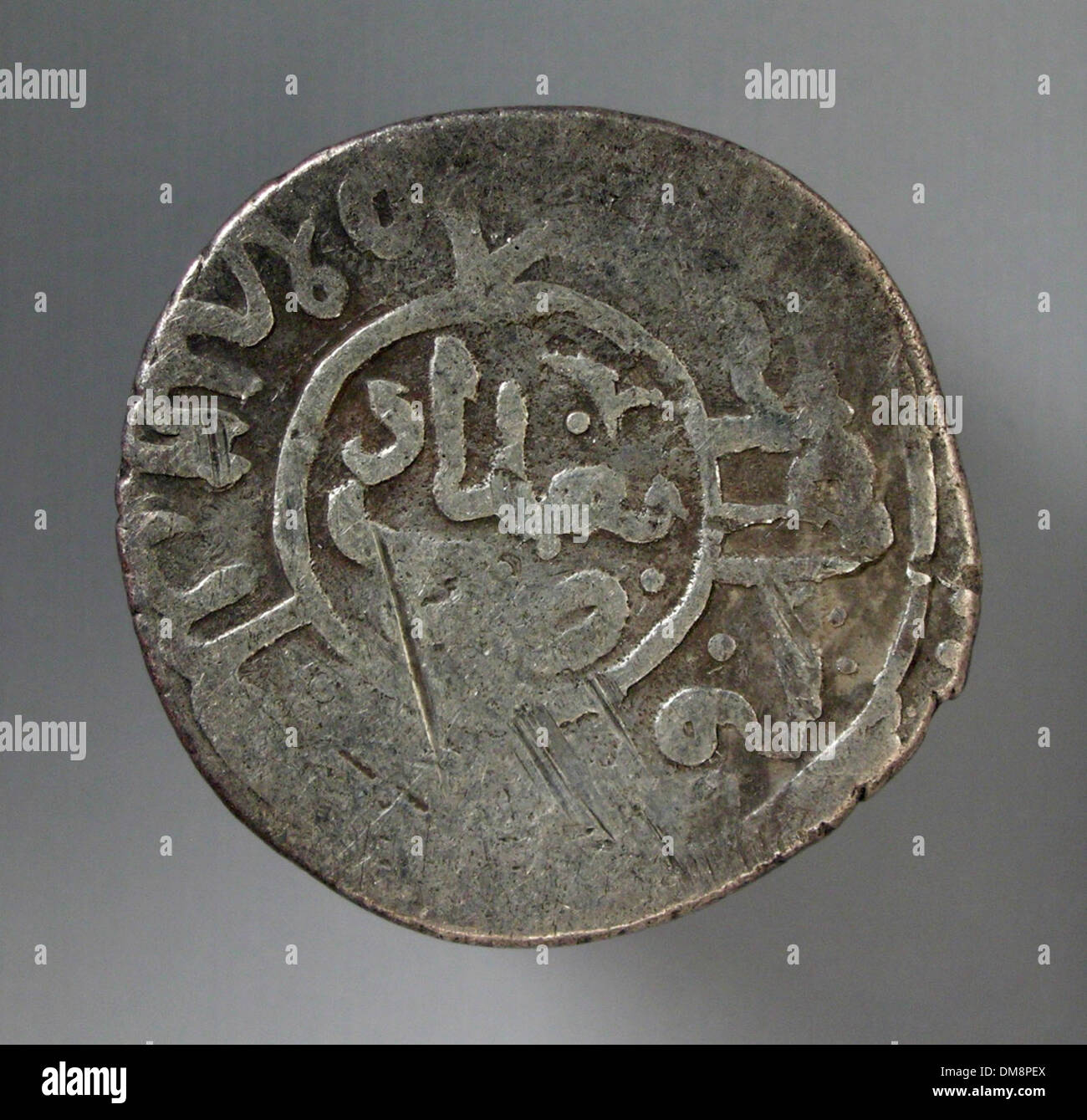 A silver Aqcha (dirham) coin, originating from the ancient and Islamic ...
