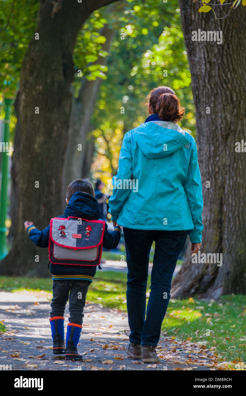 Mother and child on their way to school Stock Photo - Alamy
