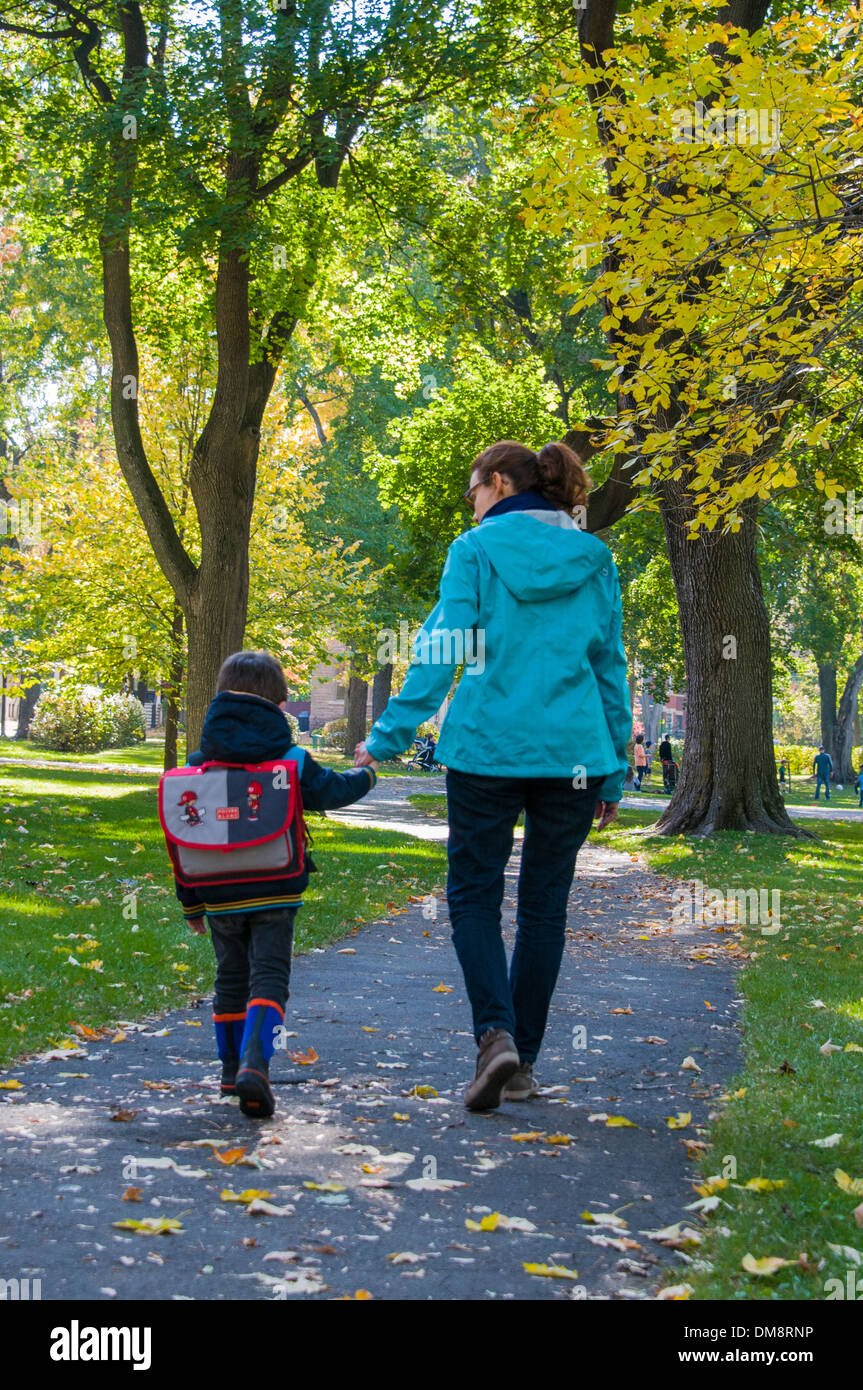 Adult and child walking Stock Photo - Alamy