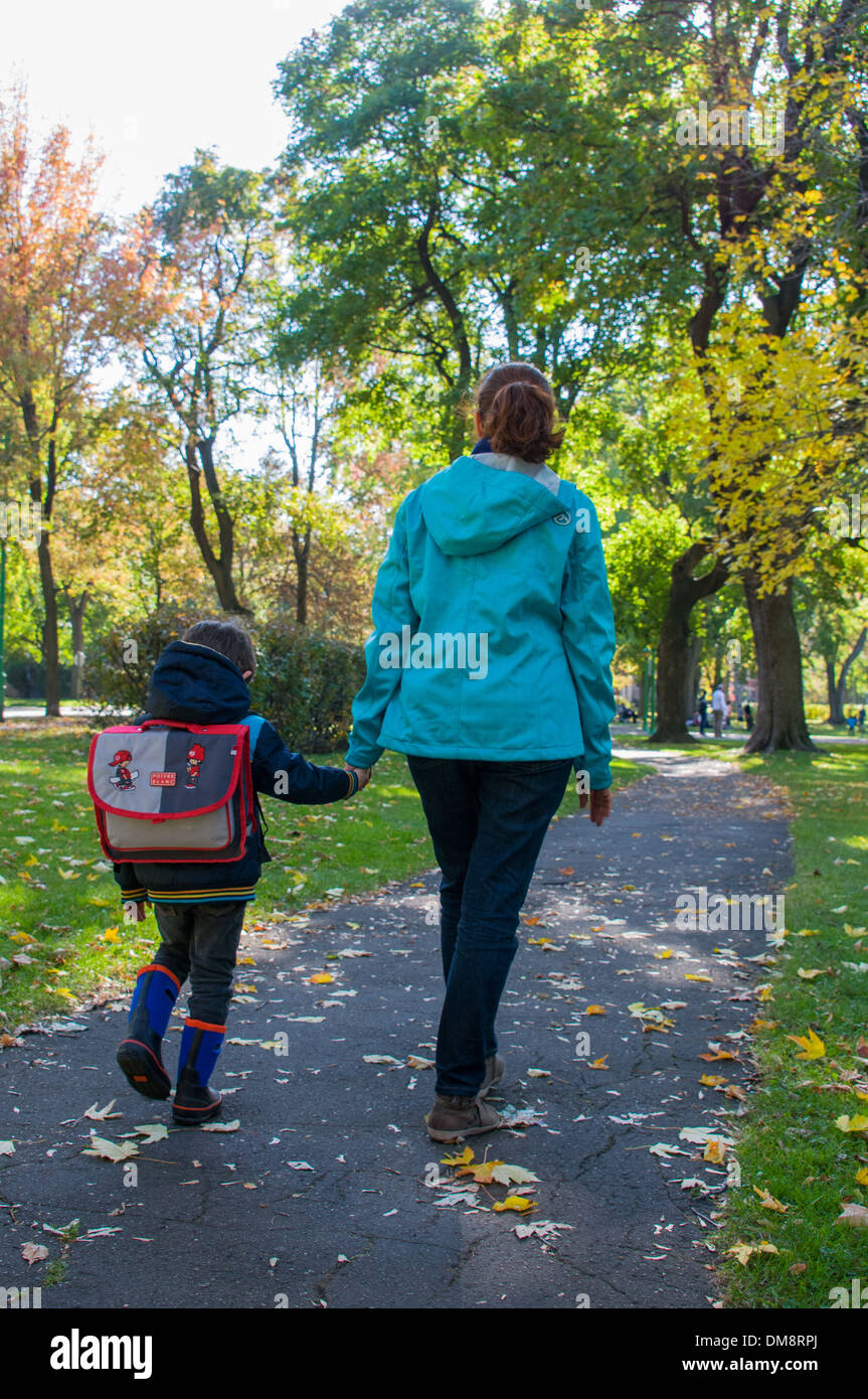 Adult and child walking Stock Photo - Alamy