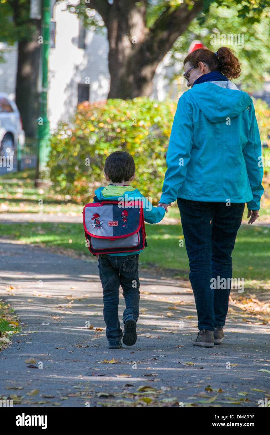 Adult and child walking Stock Photo - Alamy
