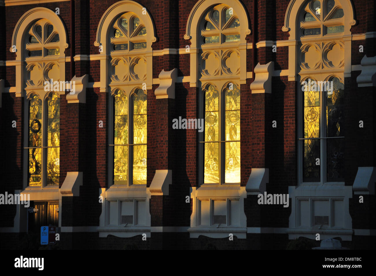 Church windows glow and shimmer reflecting the afternoon sun Stock ...