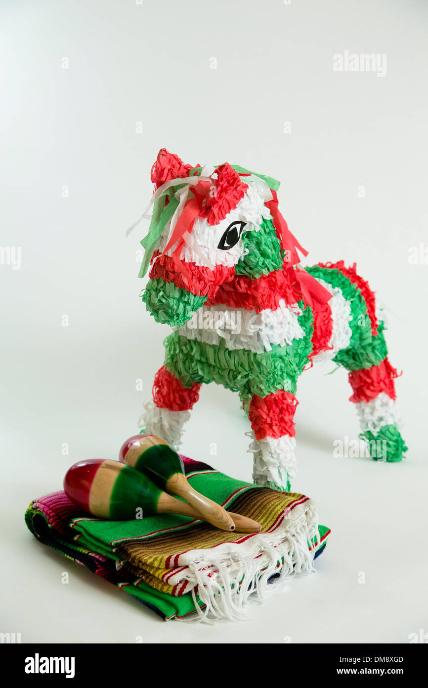 Piñata with maracas and a zerape on white background Stock Photo - Alamy