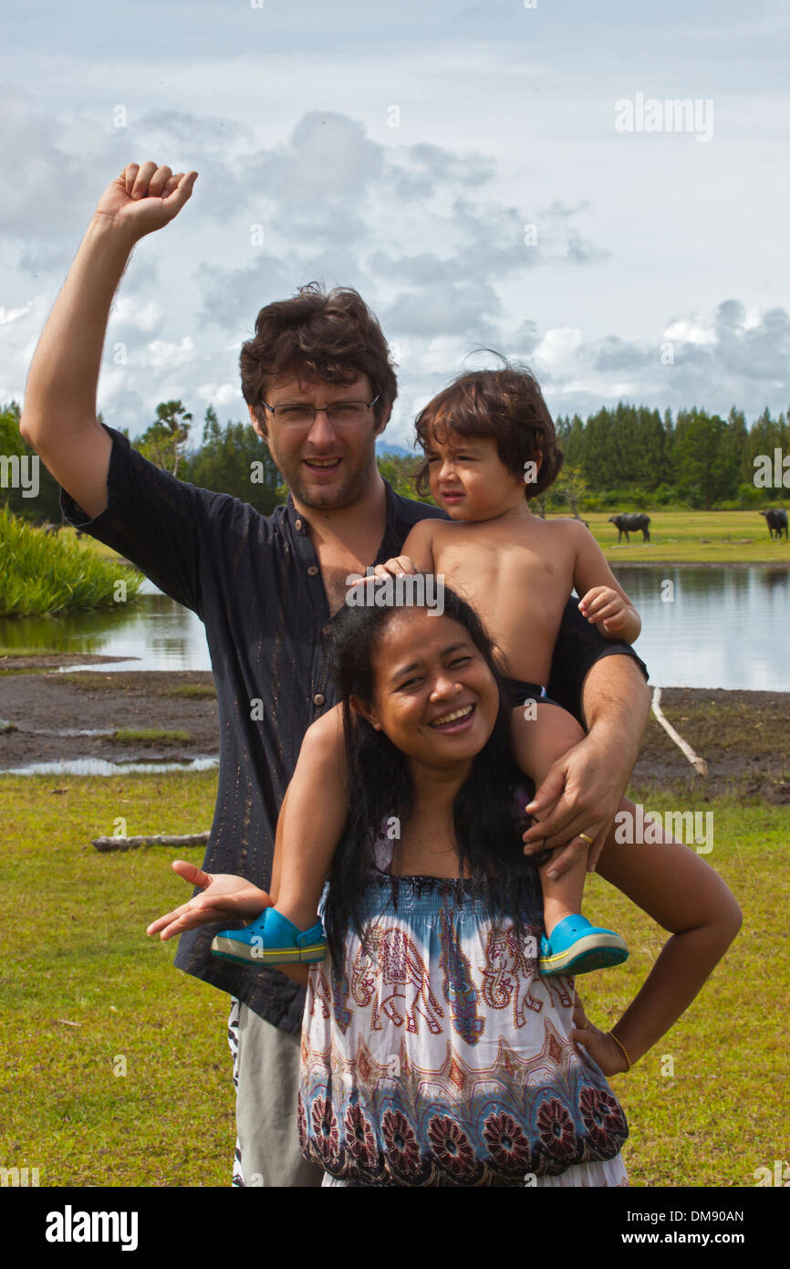 A young half Thai half American child with his father and and mother ...