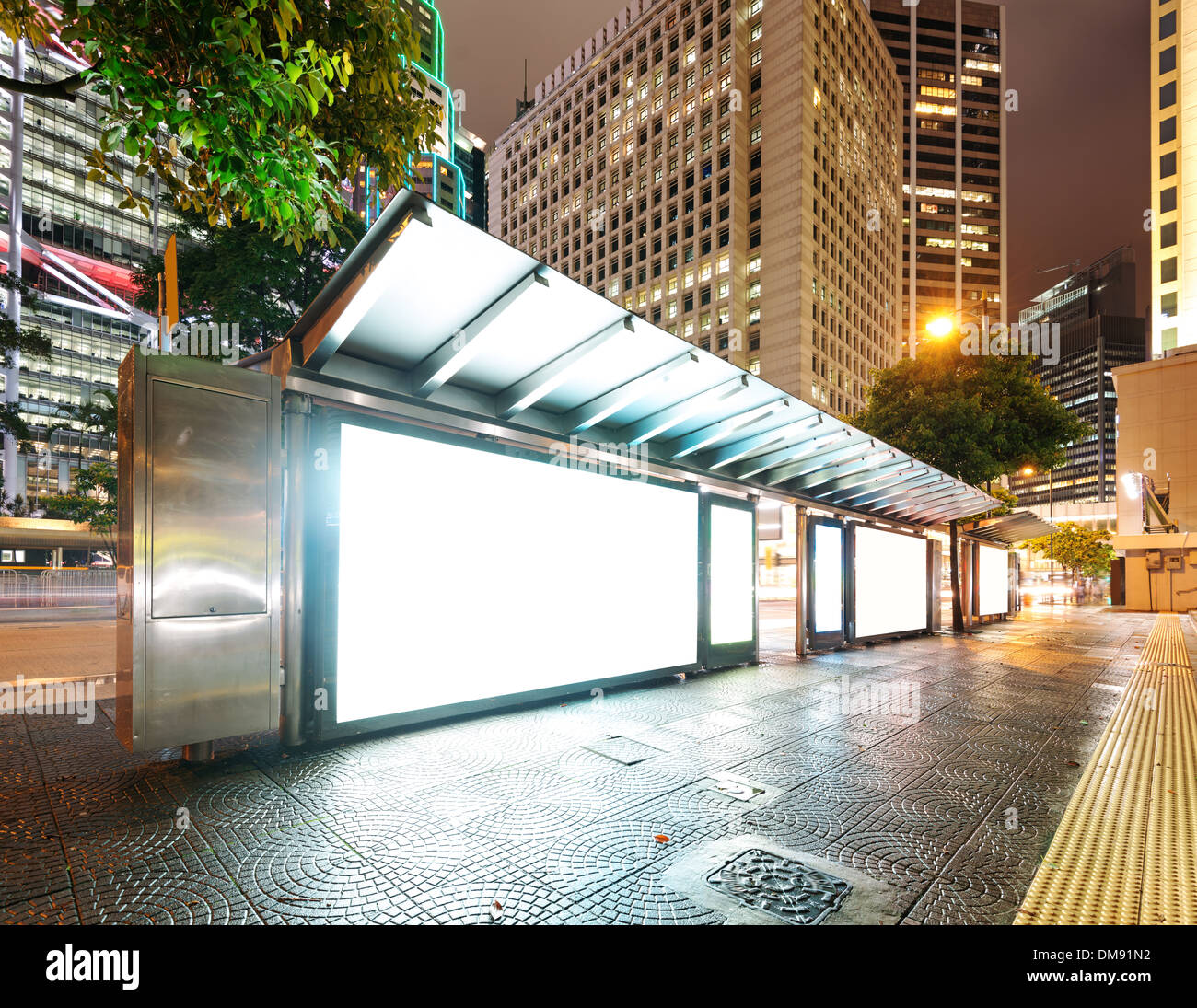 Blank billboard on bus stop at night Stock Photo - Alamy