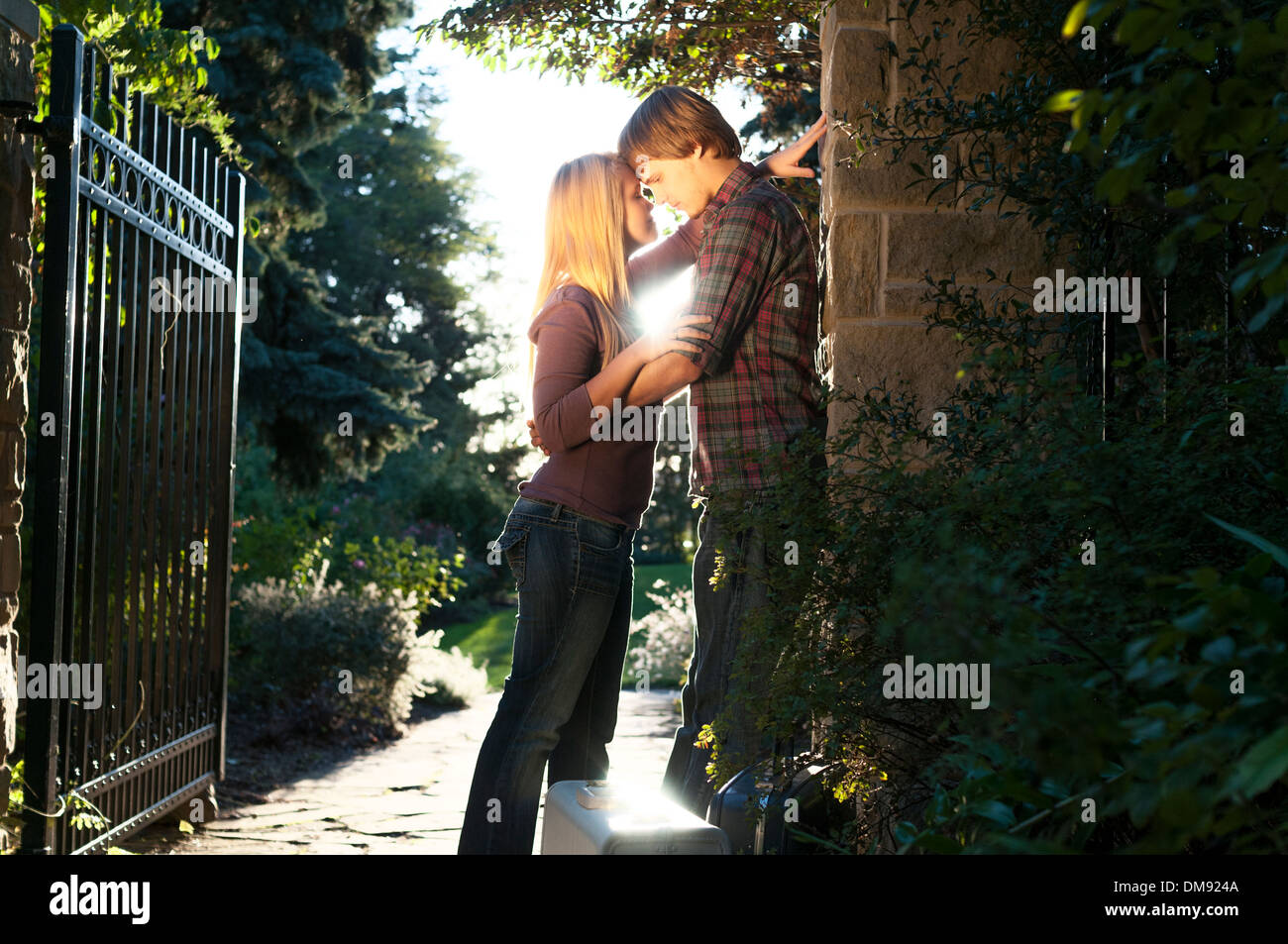 Two young people staring into each other's eyes at the entrance to a ...