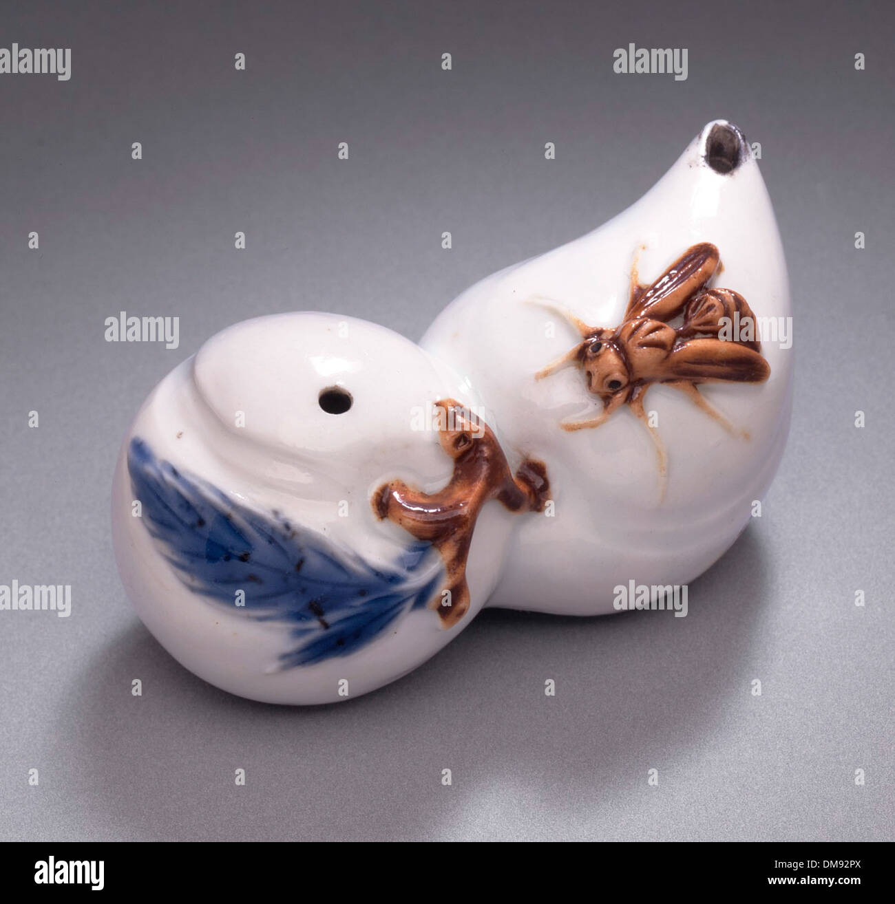 This ancient Japanese water dropper, in the shape of two chestnuts with ...