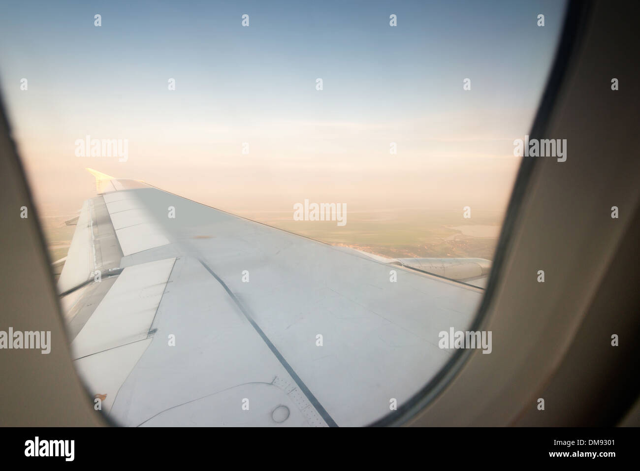 Looking through window aircraft during flight in wing with a nice blue ...