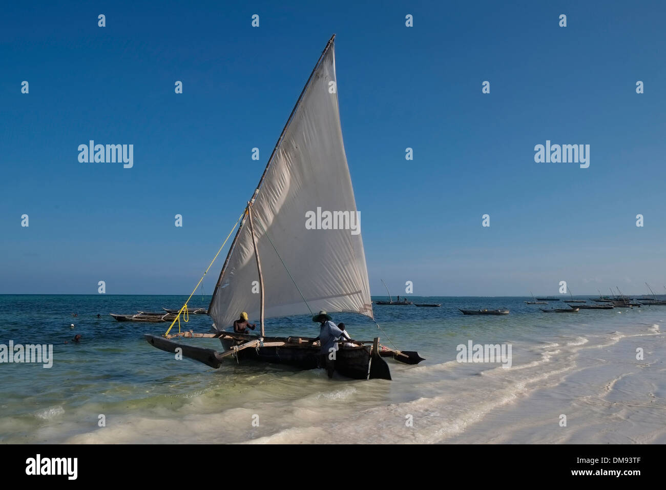 Fishermen push a Ngalawa or Ungalawa traditional, double-outrigger ...