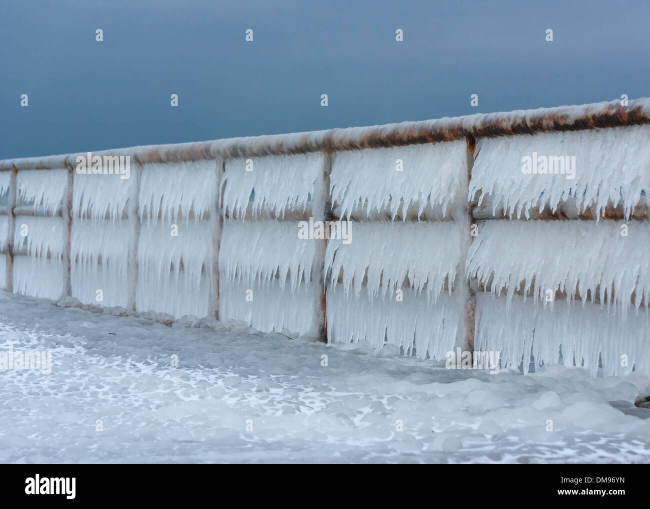 Handrail full of hanging icicles Stock Photo - Alamy