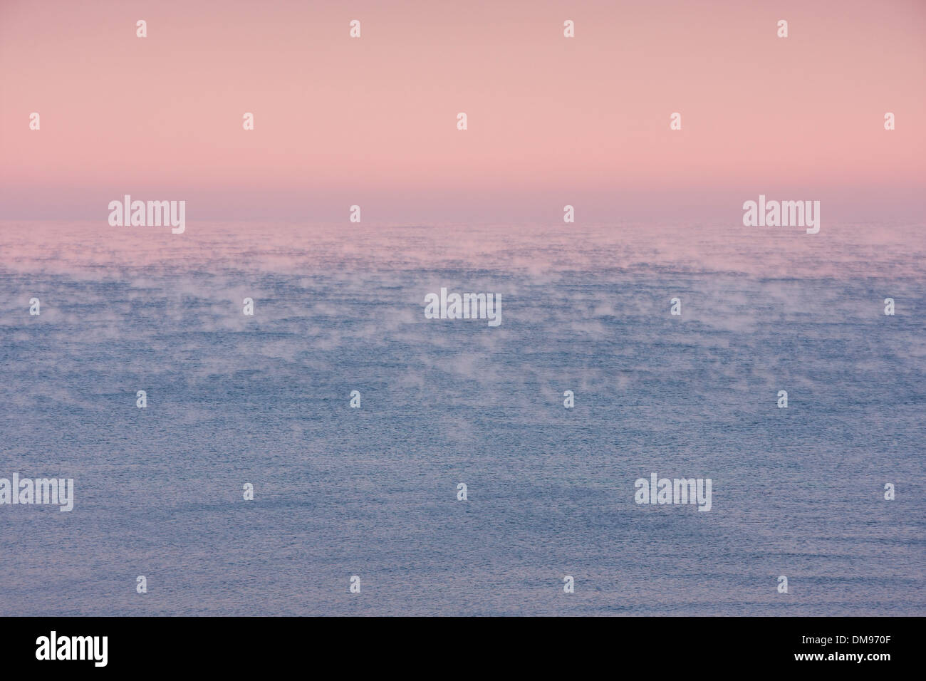 Vaporing or misty sea at pinky or rosy morning at sunrise Stock Photo ...