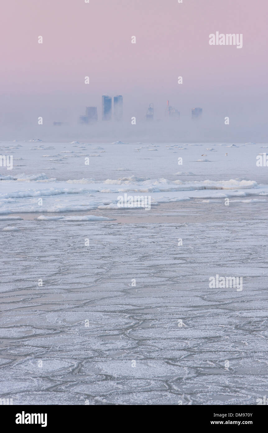 Skyscrapers in mist behind frozen water in Tallinn, Estonia Stock Photo ...