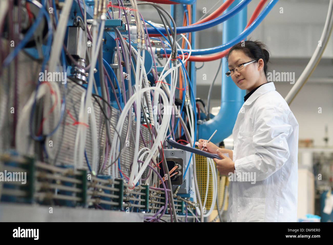 An Asia young woman working as a scientist in a technology lab Stock Photo - Alamy
