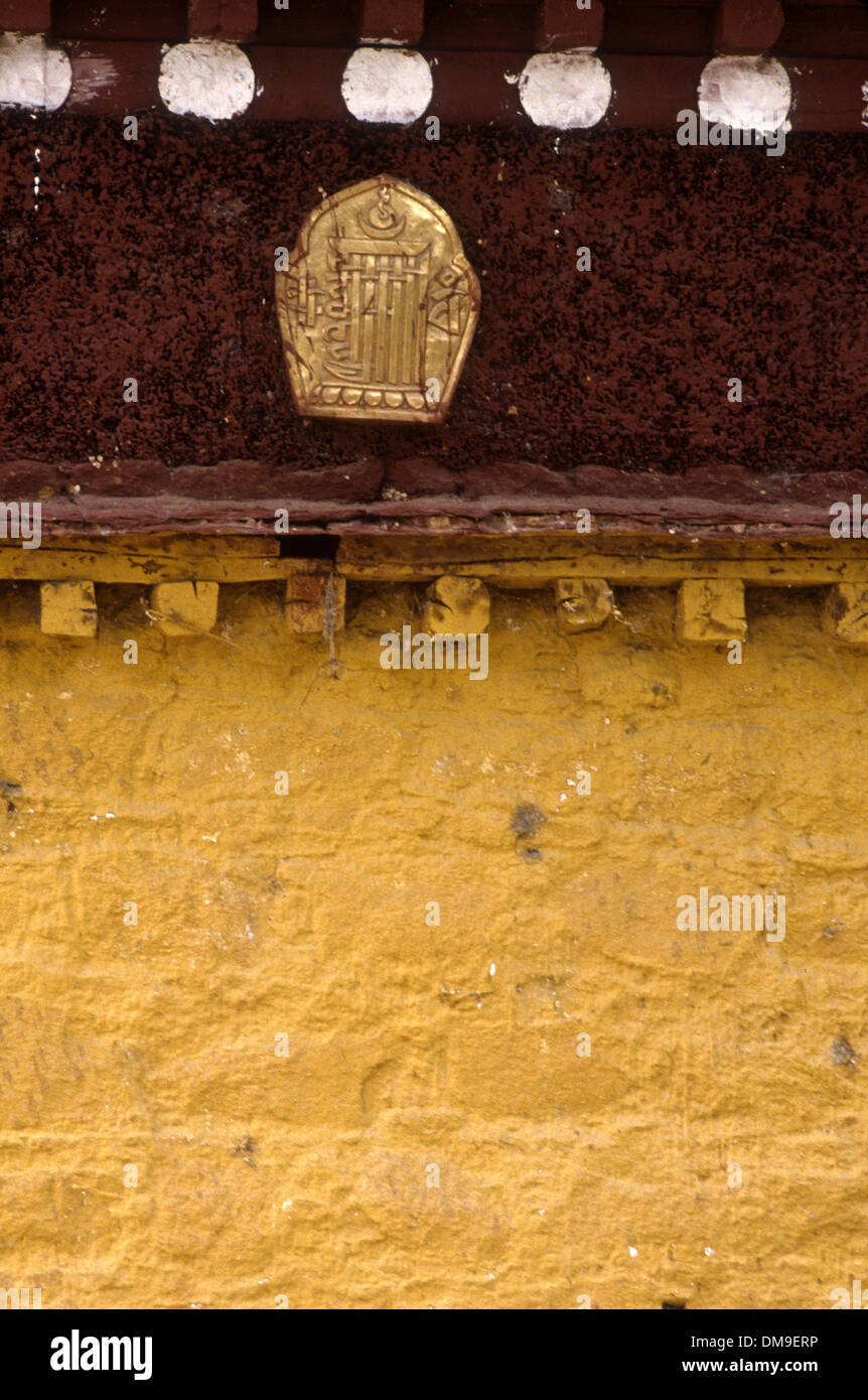 A Tibetan Buddhist symbol is placed on the wall of a monastery in Lhasa ...