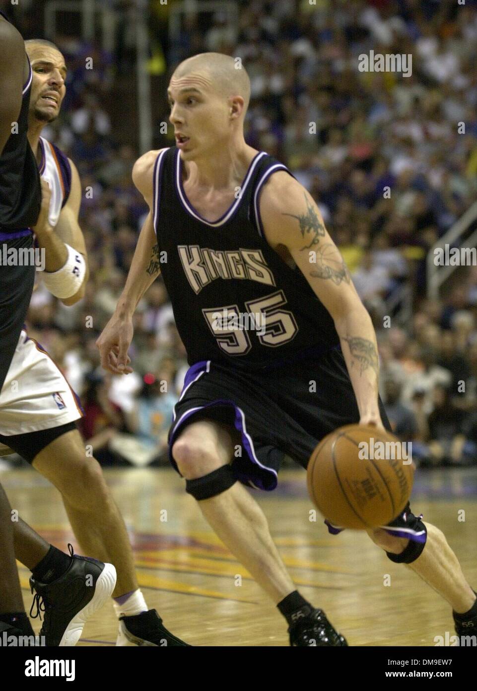 Jason Williams dribbles toward the basket as Jason Kidd gets picked ...