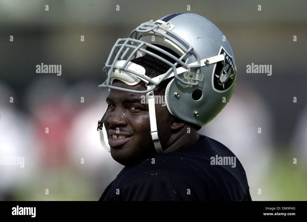 Oakland Raiders defensive tackle Grady Jackson (90) lets out a smile ...
