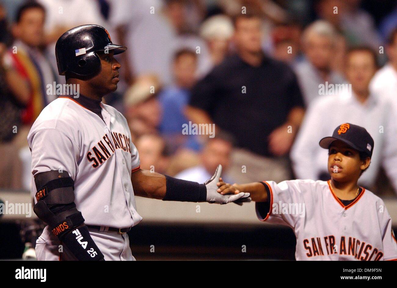 San Francisco Giants slugger Barry Bond gets five from his son Nikolai ...
