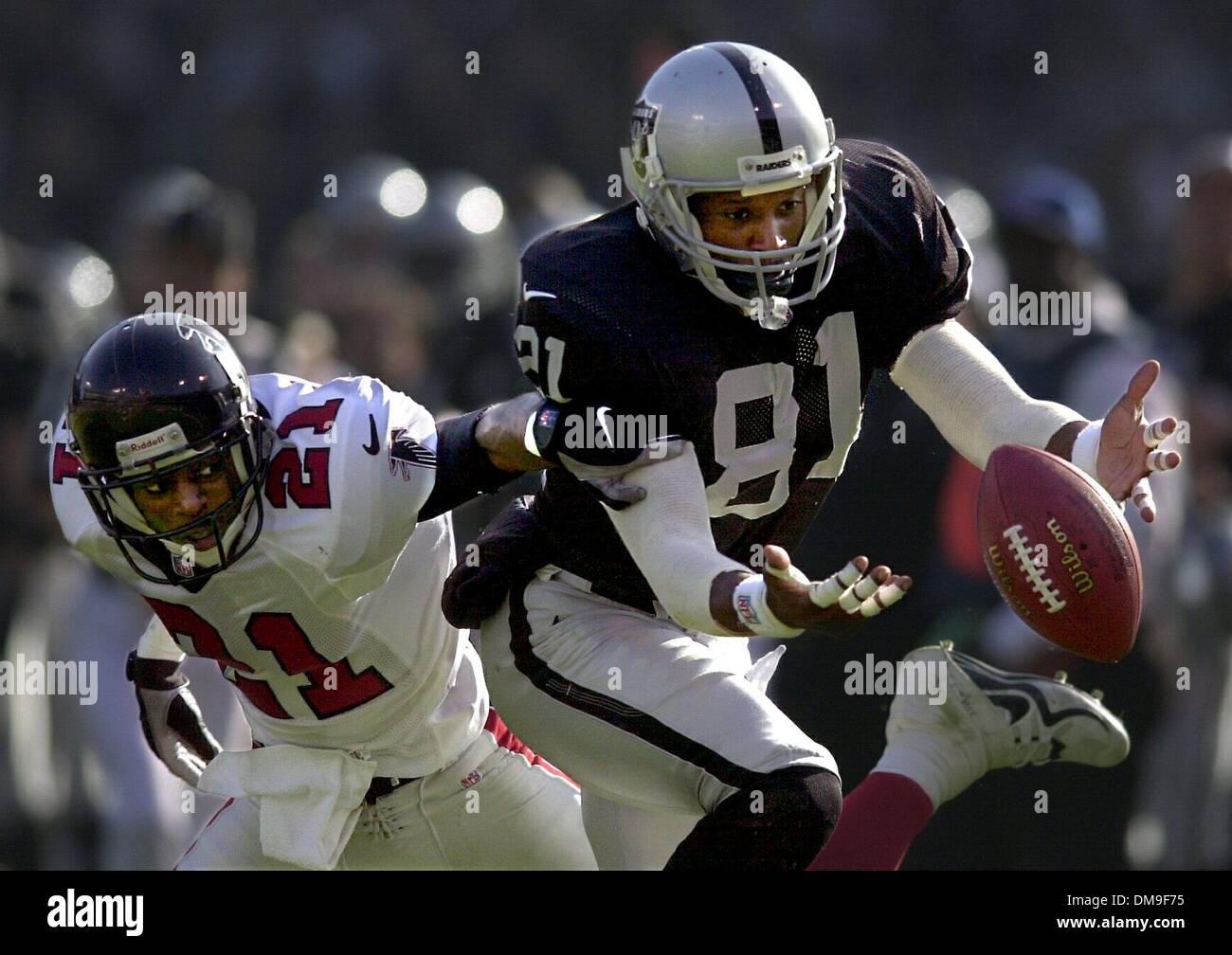 Falcon Elijah Williams (left) saves a touchdown by grabbing the arm of ...