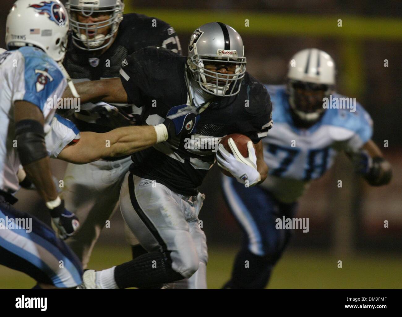 Raiders running back Charlie Garner runs for long yardage in the 4th ...