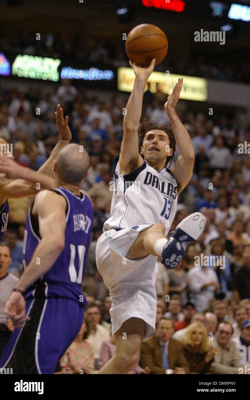 Steve Nash drives the lane and shoots against Mike Bibby in the third ...