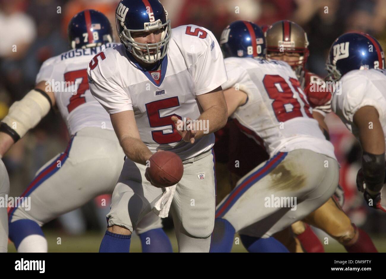 Quarterback Kerry Colins prepares a second quarter handoff to Tiki ...