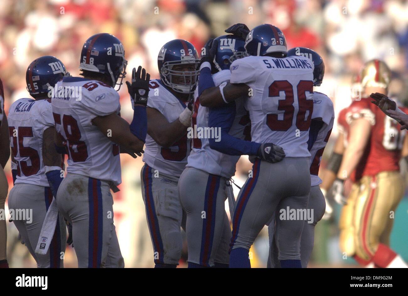 Giant Jason Sehorn celebrates with teammates after his second quarter ...