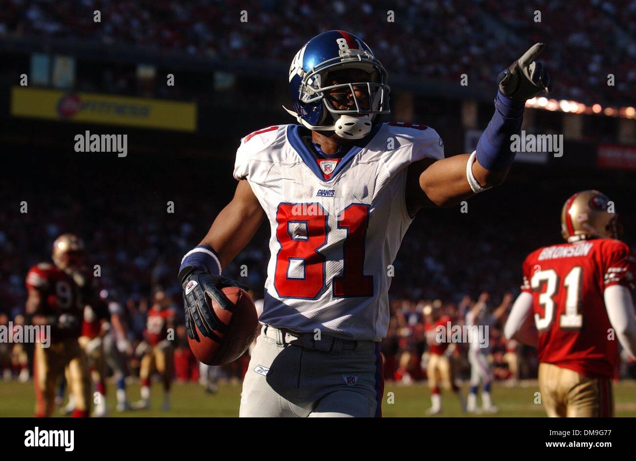 Amani Toomer celebrates scoring his first touchdown in the first ...
