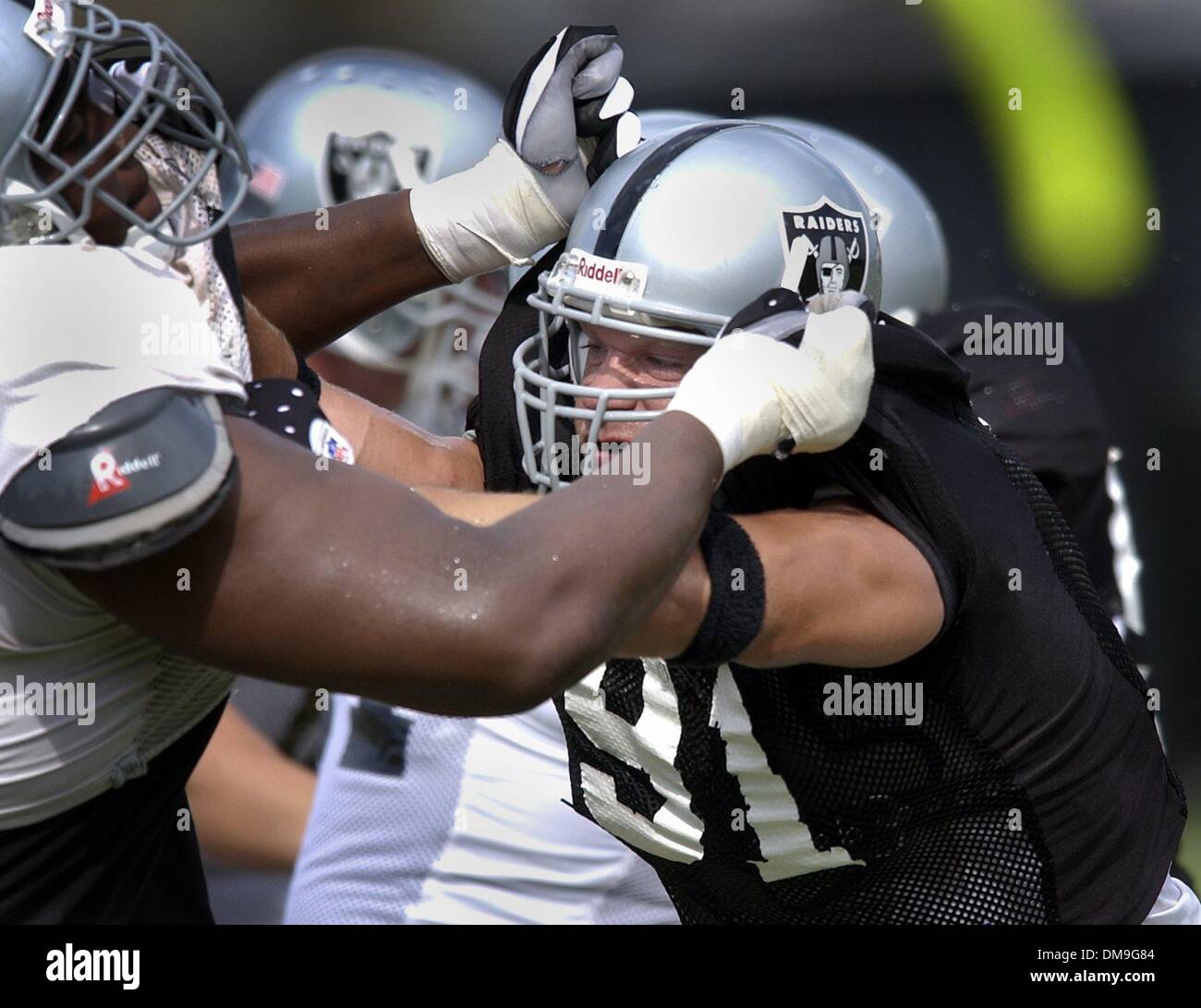 oakland Raiders defensive end Tyler Brayton mixes it up during drill at ...