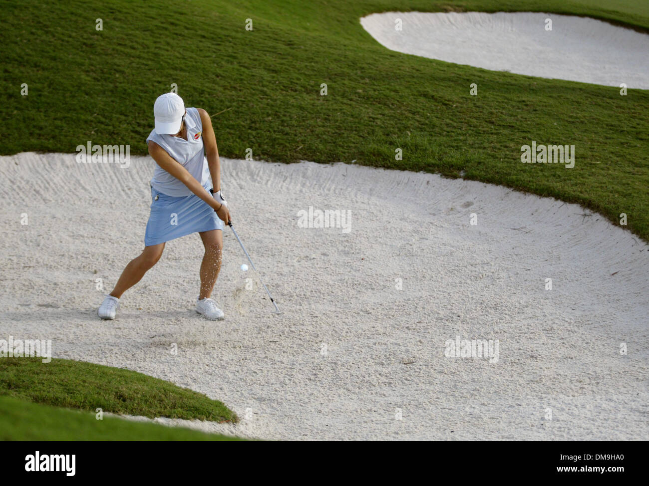 Nov 19, 2005; Palm Beach, FL, USA; Candie Kung hits the ball ouf of a ...