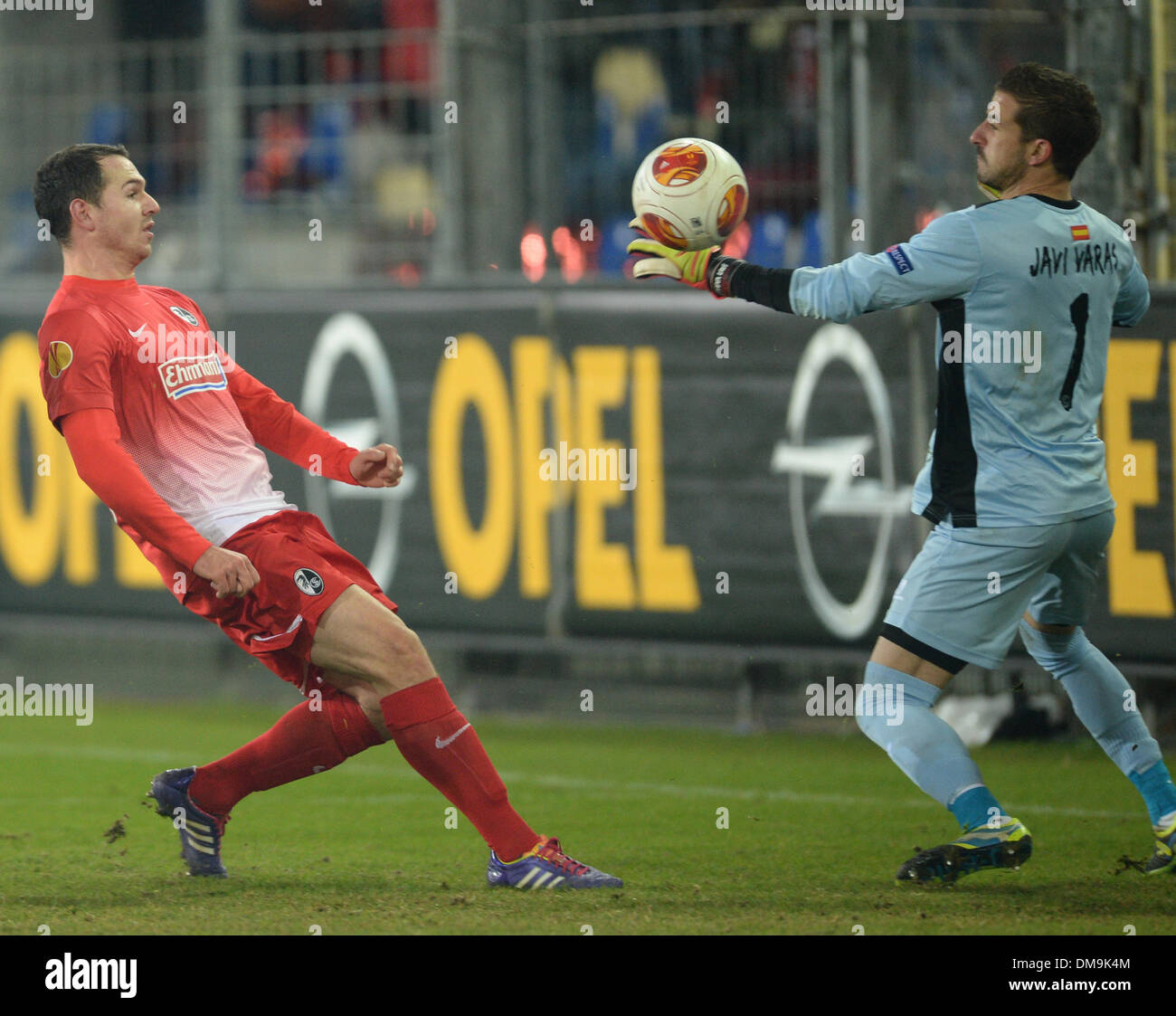 Freiburg, Germany. 12th Dec, 2013. Freiburg's Nicolas Hoefler (L) and ...