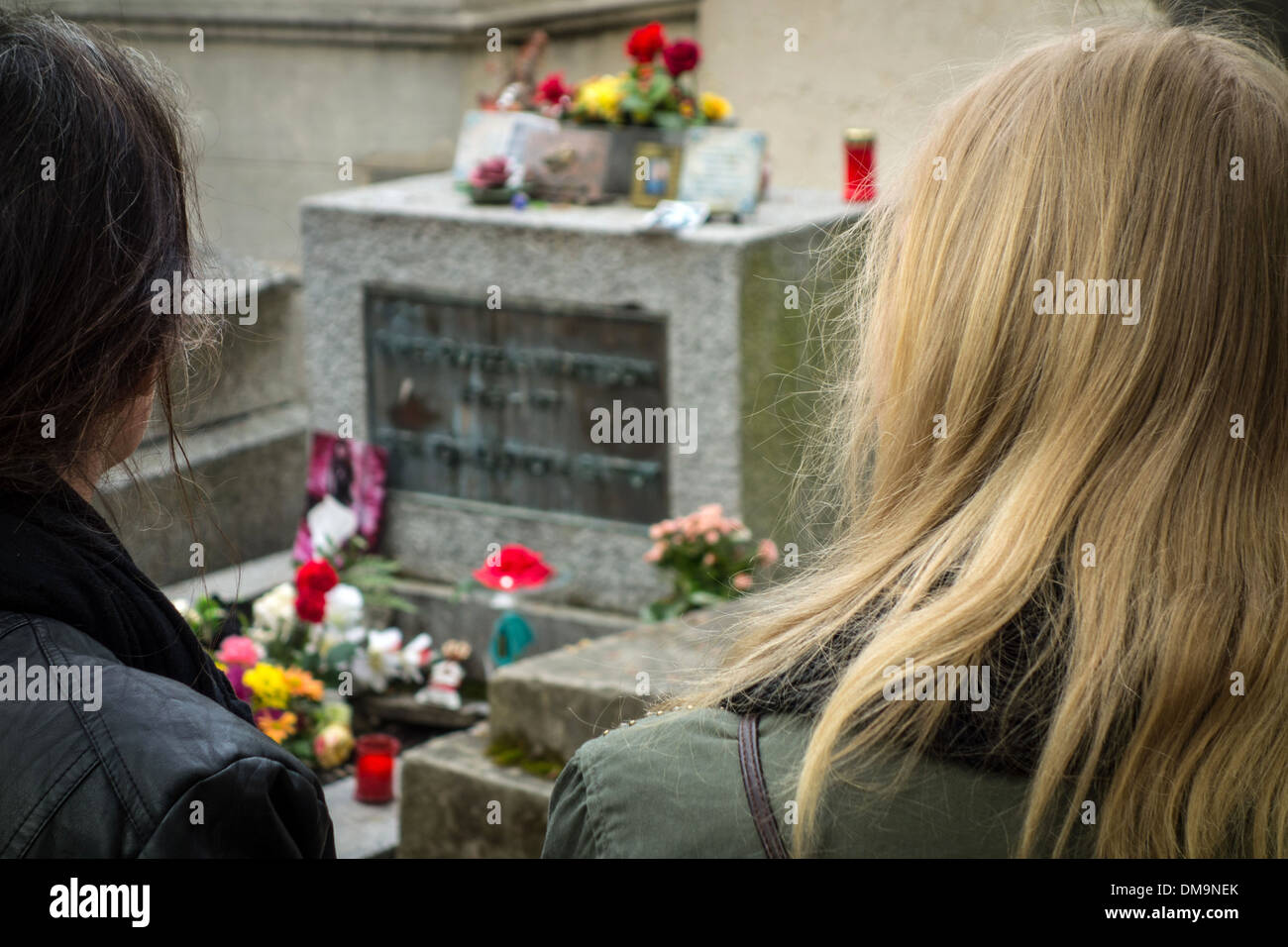 WOMEN IN FRONT OF THE GRAVE OF THE LEGENDARY SINGER FROM THE DOORS, JIM ...