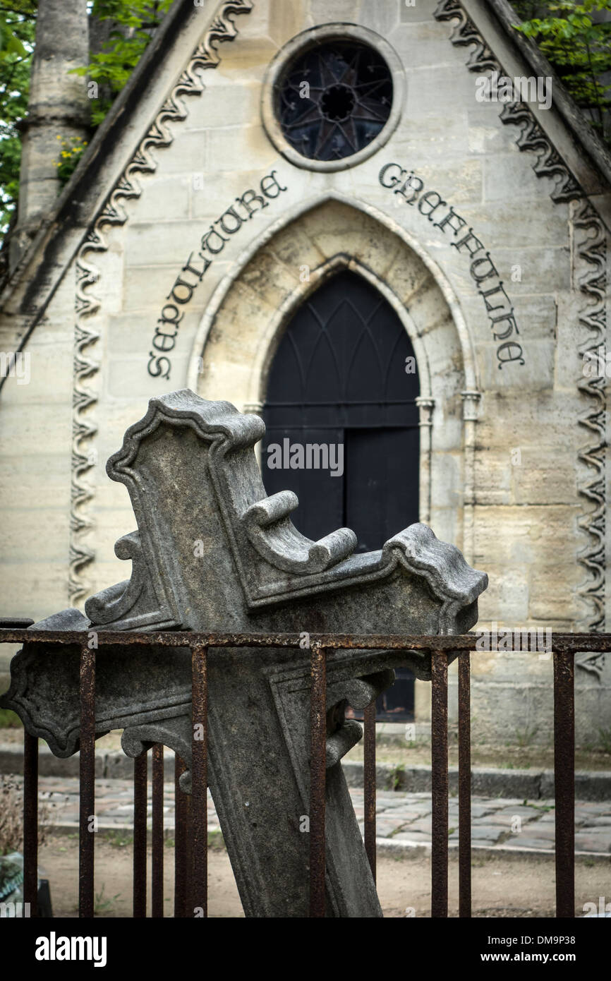 LEANING CROSS IN FRONT OF A CHAPEL IN PERE-LACHAISE CEMETERY, PARIS ...