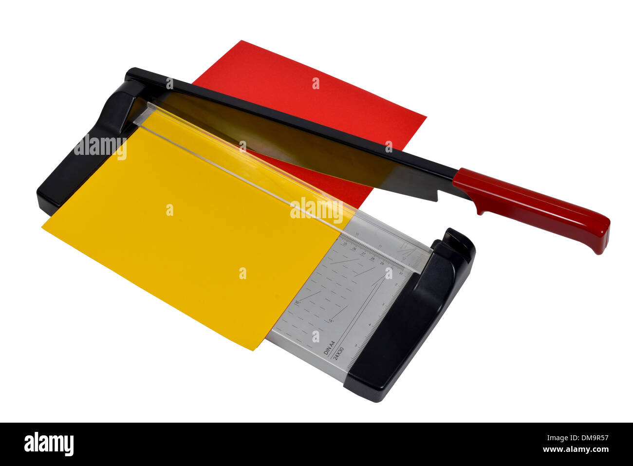 cutting paper with two sheets of colors red and yellow Stock Photo - Alamy