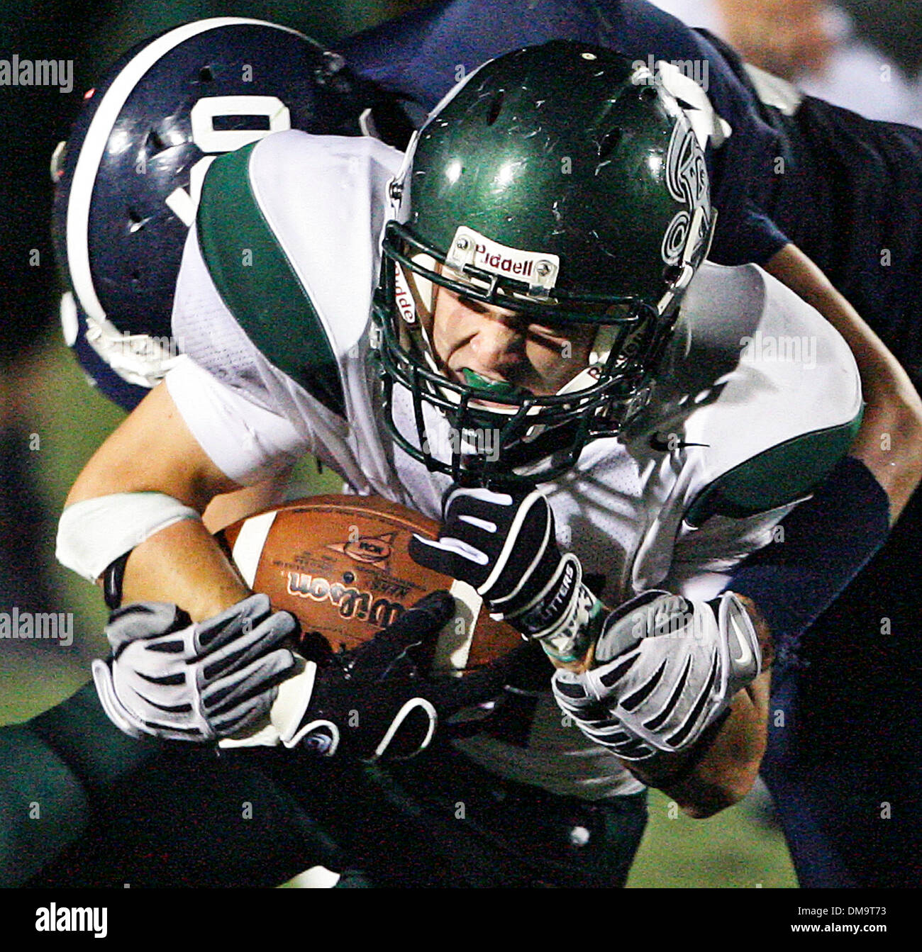 SPORTS Reagan's Jordan Mengele hangs onto the ball despite a heavy ...