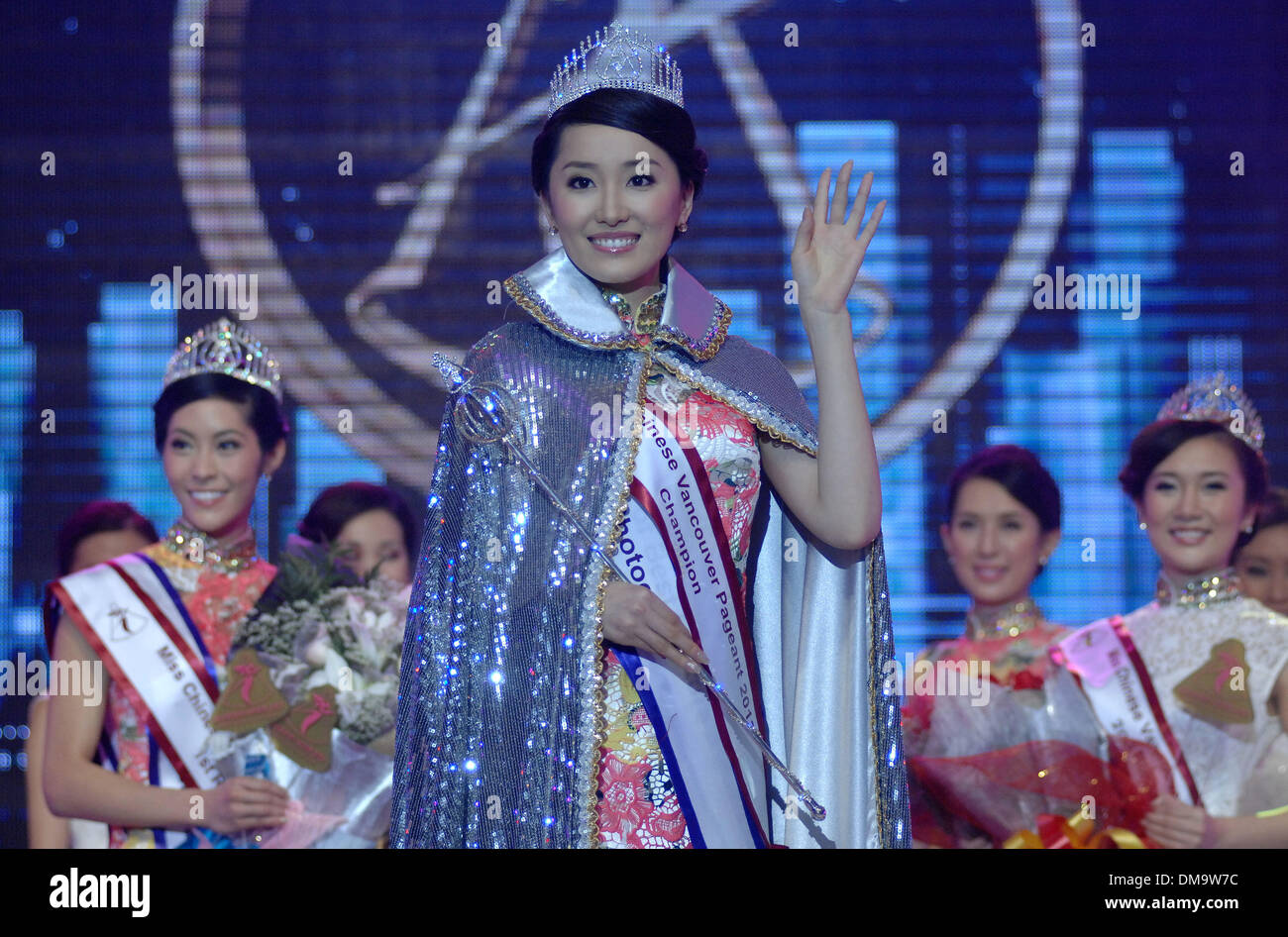 Vancouver, Canada. 13th Dec, 2013. Cindy Zhong (C) waves after being ...