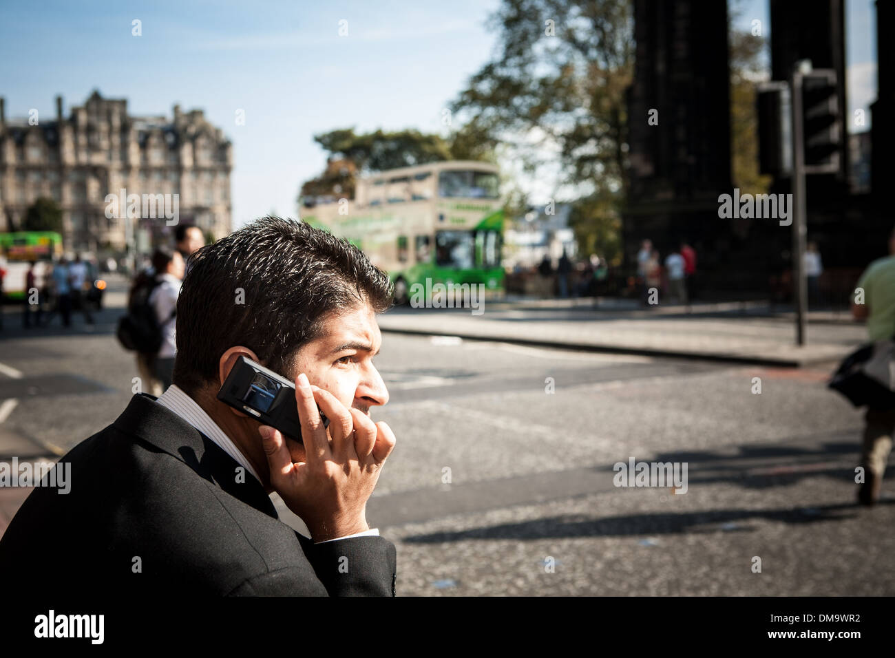 Pedestrian using Telephone, Edinburgh, Scotland Stock Photo - Alamy