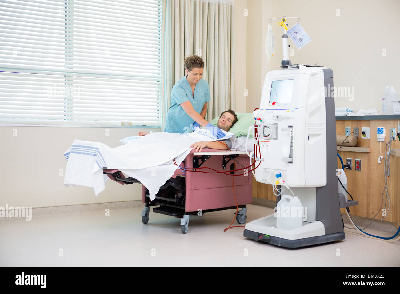 Dialysis patient with nurse hi-res stock photography and images - Alamy