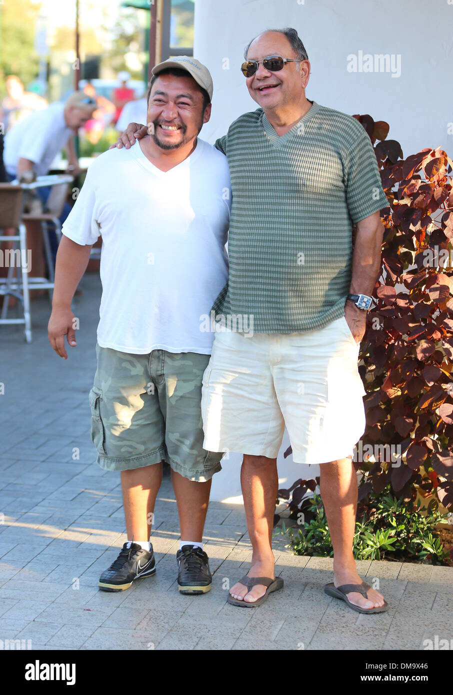 Cheech Marin poses for a picture with a fan whilst visiting Malibu ...