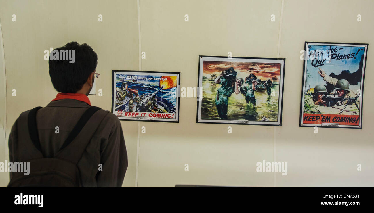 Calcutta, Indian state West Bengal. 13th Dec, 2013. A man watches war ...