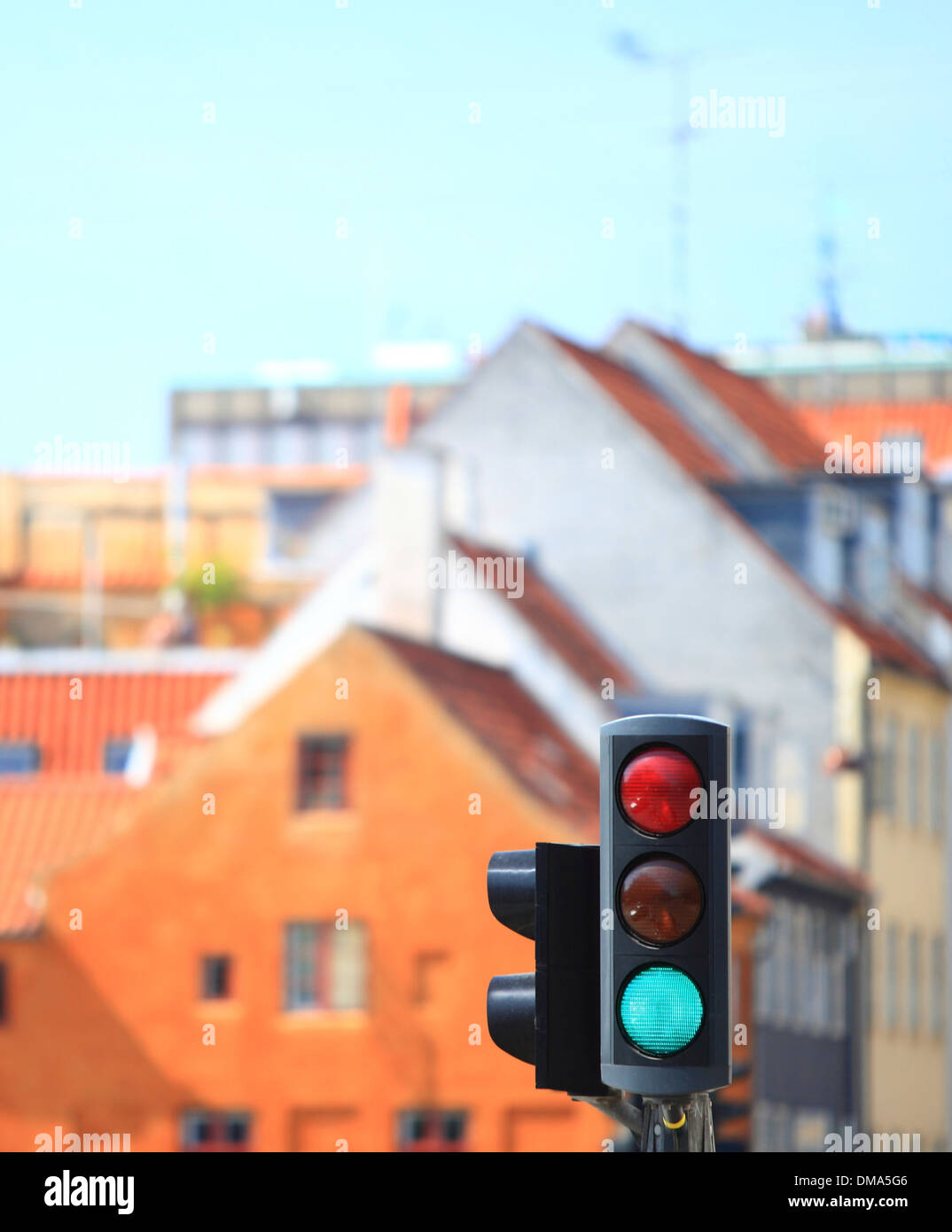Green color on the traffic lights against city background Stock Photo ...