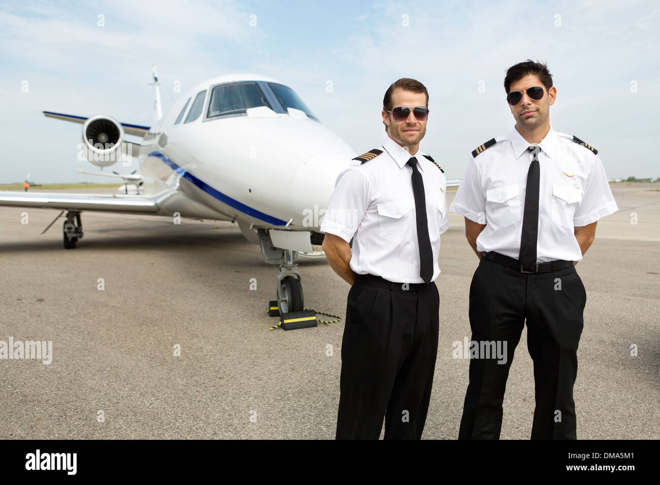 Pilots Standing In Front Of Private Jet Stock Photo - Alamy